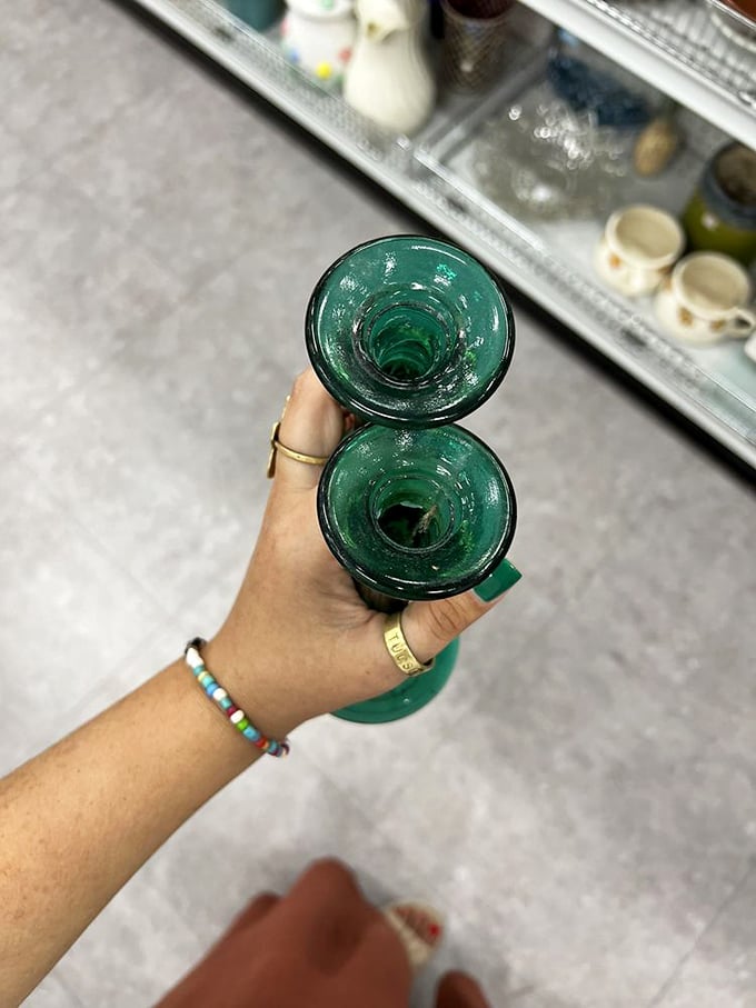 Emerald green glassware catches the light and a shopper's eye—vintage vessels ready to elevate your next dinner party.