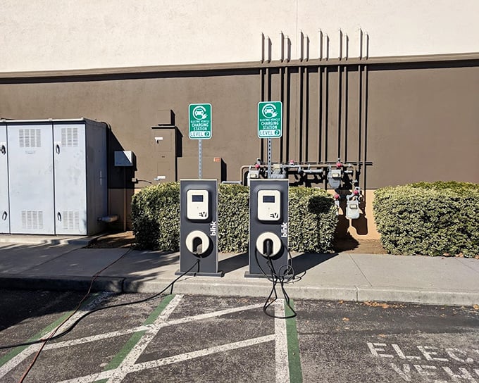 Electric vehicle charging stations—because the modern bargain hunter's carbon footprint should be as reduced as the prices they're chasing.