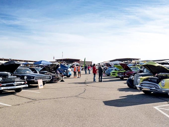 Classic car heaven under classic blue skies – where chrome gleams in the desert sun and stories of restoration projects flow as freely as engine oil.