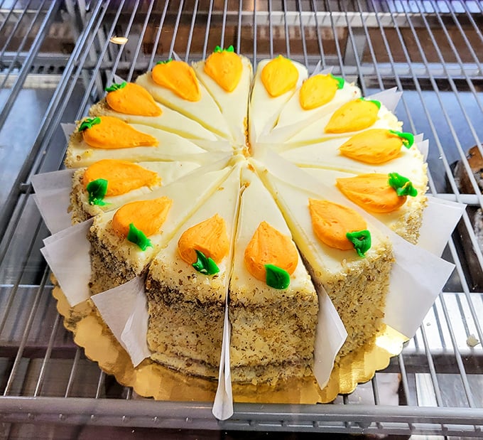 Carrot cake with cream cheese frosting and decorative carrots—because sometimes you need to pretend your dessert has nutritional value.