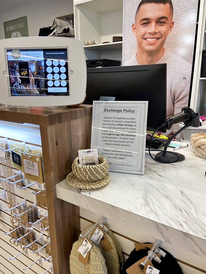 The checkout counter—where fashion dreams become reality and wallets breathe sighs of relief. That loyalty program screen promises even more savings.
