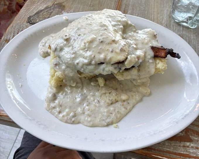 This biscuit and gravy situation isn't just comfort food—it's a warm, southern-style hug on a plate.