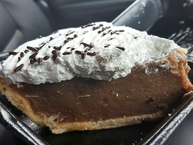 Chocolate cream pie with a cloud of whipped topping—the kind of dessert that makes you seriously consider ordering a second slice.