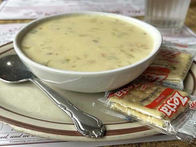 A bowl of creamy chowder that could make a New Englander weep with joy, served with crackers that know their supporting role.
