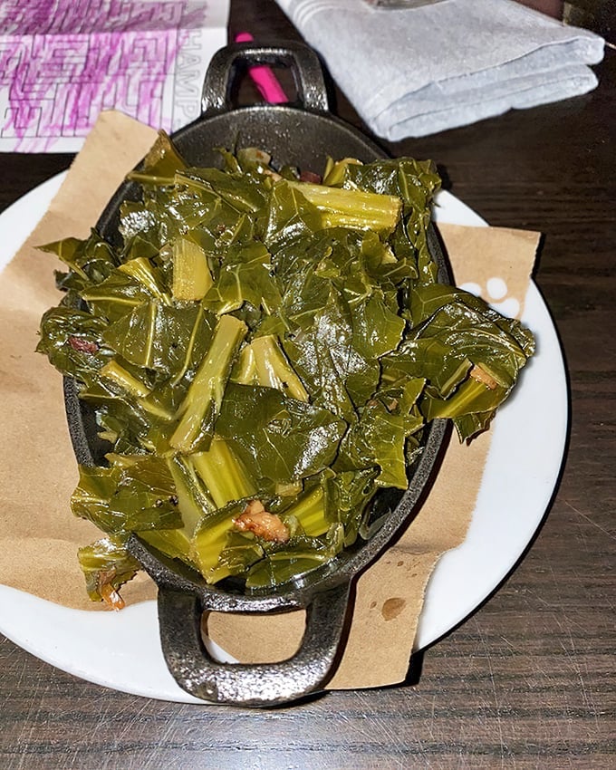Collard greens done right—tender, smoky, and unapologetically Southern. The kind that make vegetable skeptics reconsider their life choices.