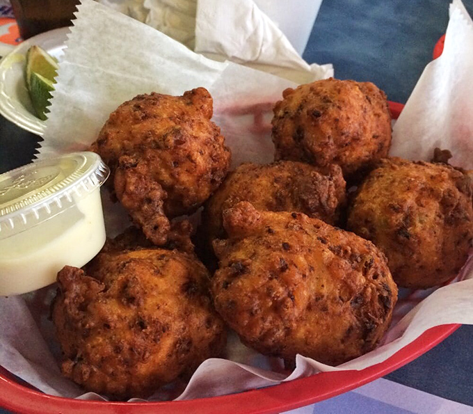 Conch fritters: golden-brown spheres of Caribbean joy. These crispy, savory bites are the perfect introduction to Bahamian flavors in the heart of Miami.