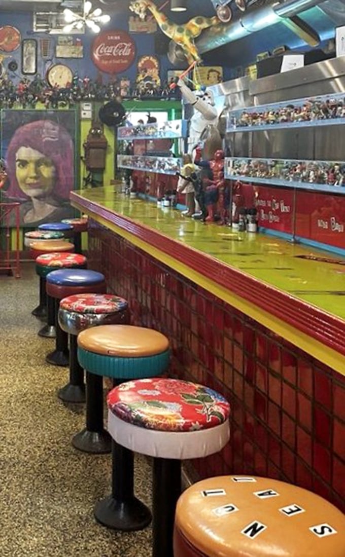 The counter feels like a time machine to a more colorful era. Those stools have heard thousands of "Oh my god, look at that!" exclamations.
