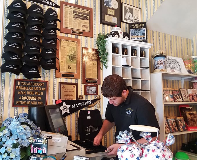 "If you are grouchy, irritable, or just plain mean, there will be a $10 charge"—Mayberry humor that perfectly captures the cafe's playful, wholesome spirit.