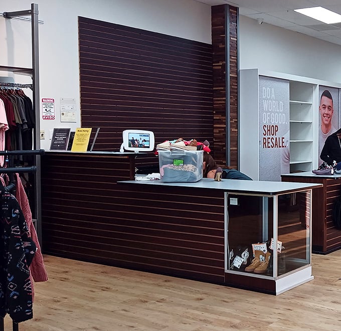 Behind this sleek counter, fashion dreams come true. "Do a world of good. Shop resale" isn't just a slogan—it's a lifestyle.