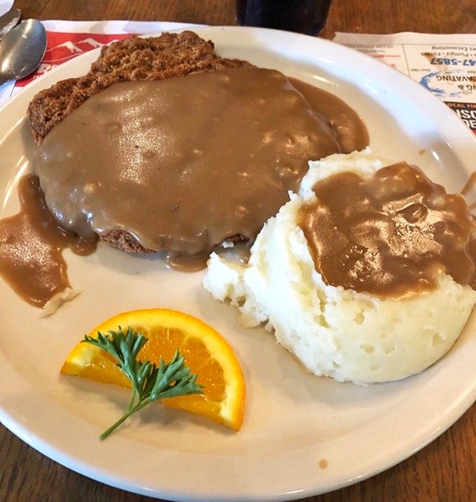 Country-fried steak swimming in gravy—comfort food that hugs your insides like your favorite childhood blanket.