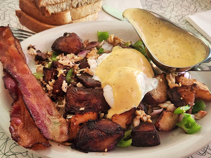 Breakfast reimagined—tender crab hash topped with perfectly poached eggs and hollandaise. Morning glory that would make hitting the snooze button a criminal offense.
