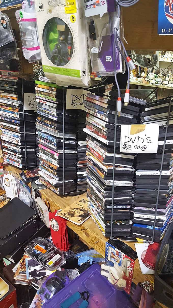 DVD towers stand like monuments to pre-streaming entertainment. Each $2 disc a portal to movie night nostalgia.