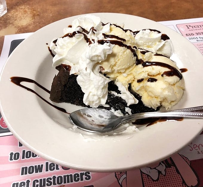 Dessert that doesn't know the meaning of restraint – ice cream, whipped cream, and chocolate creating a sweet symphony of indulgence.