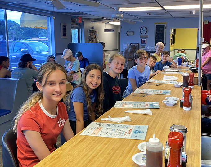 Multi-generational dining is alive and well at Grannie's, where families gather around wooden tables for food that transcends age gaps.