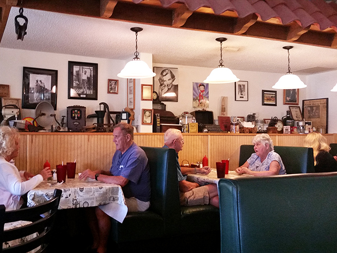 Regulars holding court in their unofficial assigned seats, solving the world's problems one cup at a time.