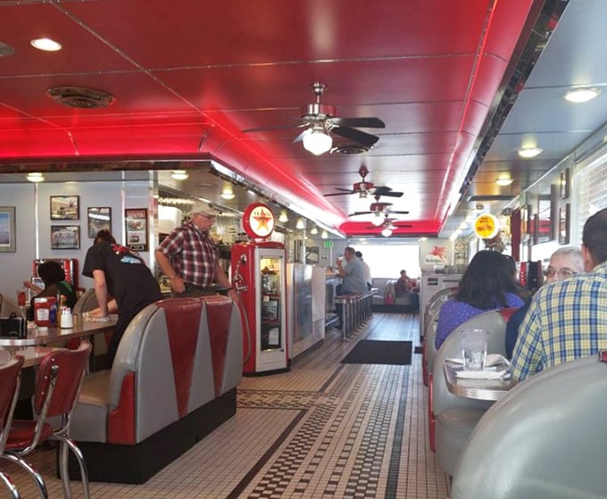 Where strangers become neighbors over plates of home-style cooking. The red ceiling adds warmth that matches the service below.