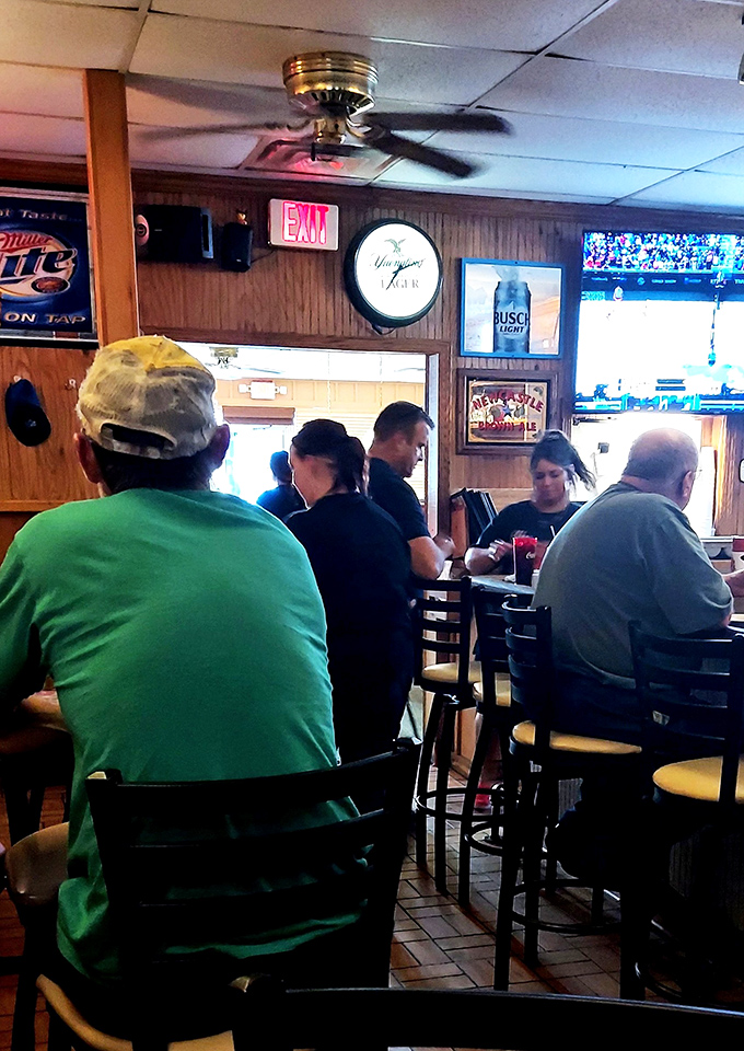 The true measure of a local pizza spot: regulars who've claimed their favorite tables and know exactly what they're ordering before sitting down.