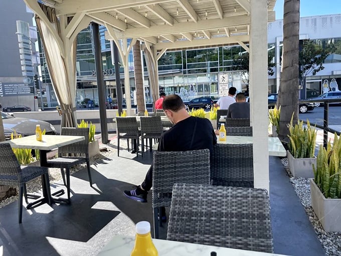 The perfect spot for people-watching while destroying a sandwich the size of your head.