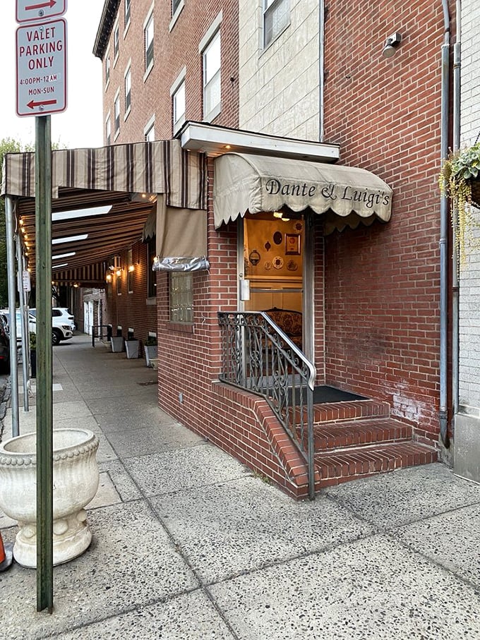 The brick entrance with its classic awning doesn't just mark a doorway—it's a portal to one of Philadelphia's most beloved Italian dining experiences.