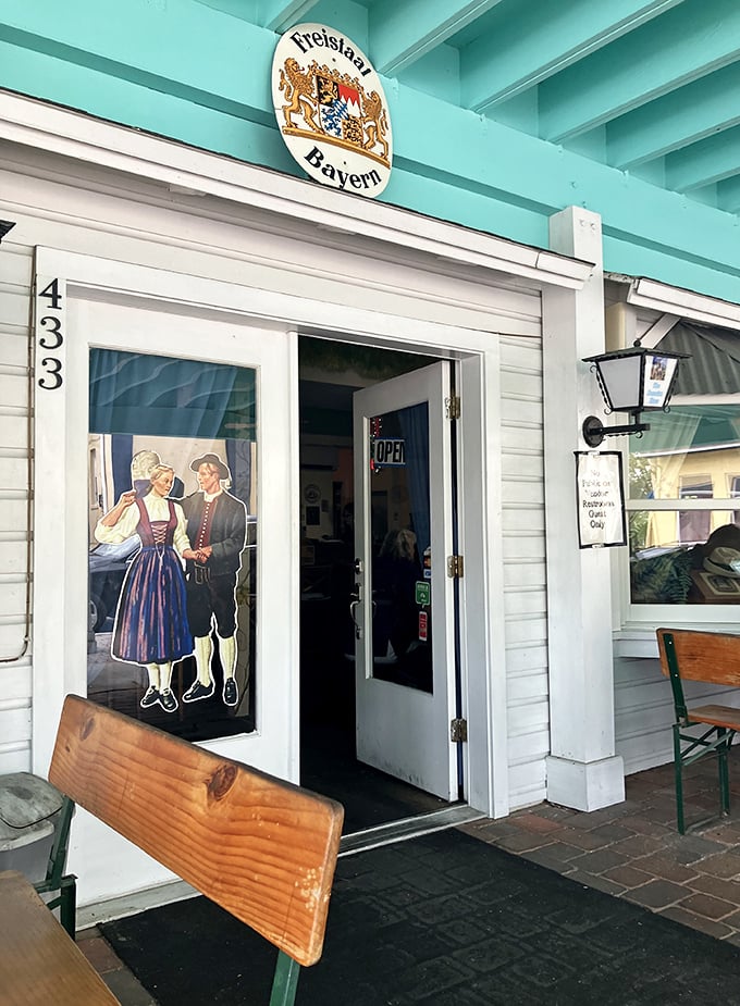 The entrance sets the tone immediately—traditional Bavarian couple welcoming you like old friends who've been expecting your visit. 