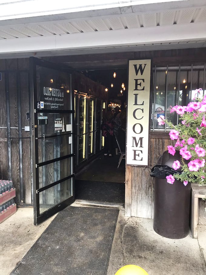 The "WELCOME" sign isn't just being polite—it's offering fair warning that your clothes will soon smell deliciously of smoke.