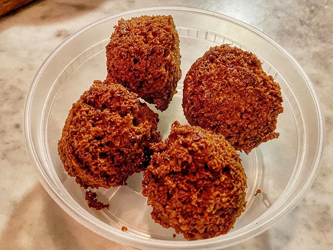 Falafel that actually tastes like chickpeas and herbs rather than just "fried"—crispy exteriors giving way to fluffy, fragrant interiors that would make Tel Aviv proud.