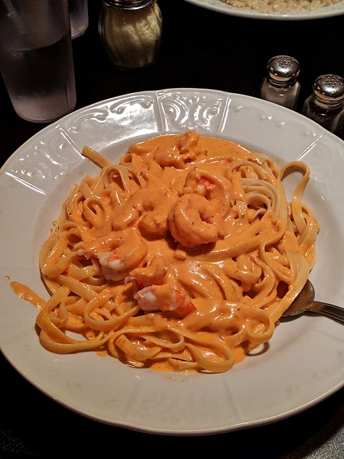 Fettuccine Alfredo so gloriously rich it should come with its own tax bracket. Those shrimp aren't just added—they're honored guests.