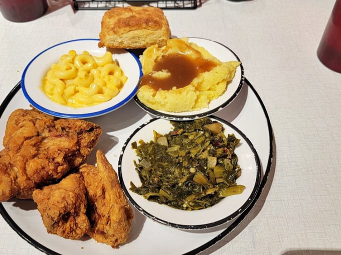 Southern fried chicken, mac and cheese, mashed potatoes, and greens—a plate that sings harmony better than a Nashville quartet on Saturday night. 