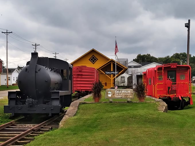 Vintage railway cars and a bright yellow station house preserve Gallipolis' transportation heritage, standing as colorful reminders of the town's connected past.