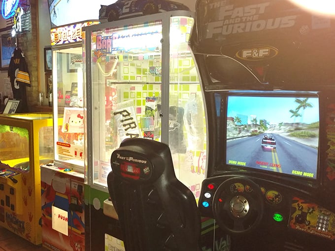 Between bites, test your driving skills on classic arcade games – because sometimes adults need playground time too.