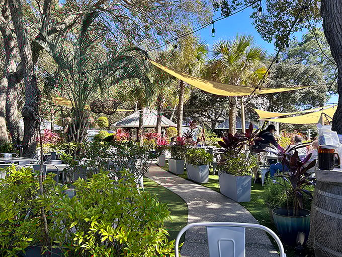 Garden pathways lined with tropical plants create a lush paradise that makes every visit feel like a vacation.