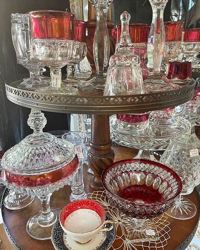 Ruby-rimmed glassware catches the light like liquid jewelry—these cranberry and clear crystal pieces would elevate even a simple glass of water to special occasion status.