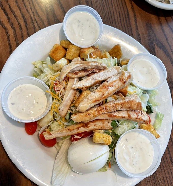 A grilled chicken salad that doesn't just check the "healthy option" box—it throws open the door and invites freshness to the party.