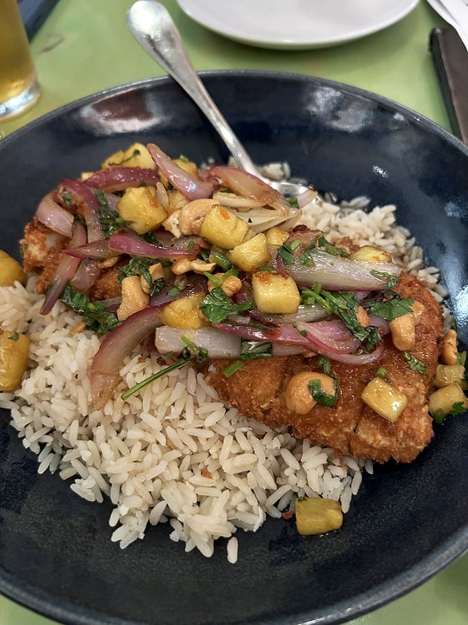 Sweet potato crusted fish over coconut rice—a dish so perfectly executed it deserves its own fan club.