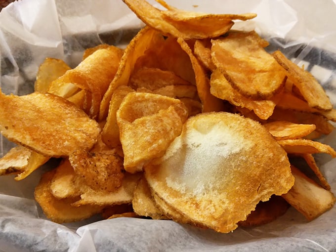 Homemade potato chips that crackle with freshness—each golden disc a testament to the care that goes into even the simplest sides.