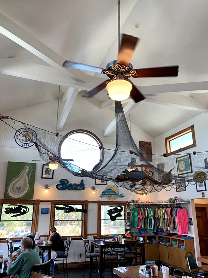 Fishing nets suspended from the ceiling aren't just decoration—they're a reminder that your dinner didn't come from some distant warehouse freezer.