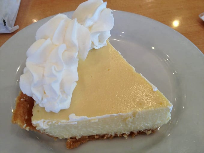 Key lime pie that captures Florida sunshine in every bite. That cloud of whipped cream isn't garnish—it's the perfect counterpoint to citrus tang.