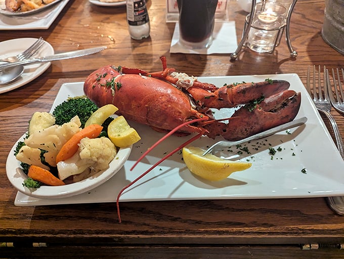This lobster didn't just arrive on your plate – it made a grand entrance, dressed in its finest red with vegetables as supporting actors.