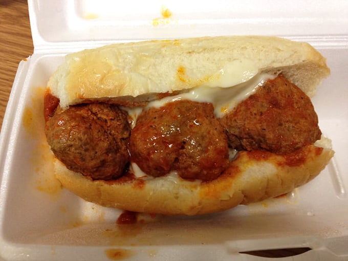 Meatballs nestled in bread like three best friends who found their perfect home together.