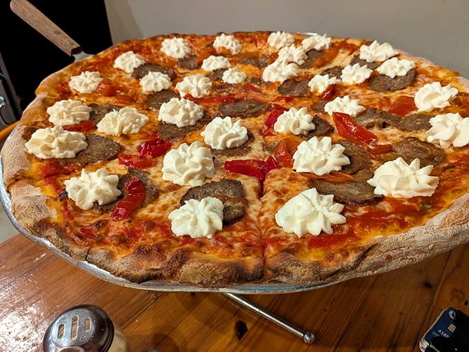 Not your average pizza – those dollops of cream against the savory meatballs and roasted peppers create a flavor symphony that makes ordinary pizza weep with jealousy.