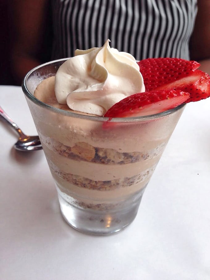 Dessert architecture at its finest—layers of mocha tiramisu that deserve their own blueprint and building permit.