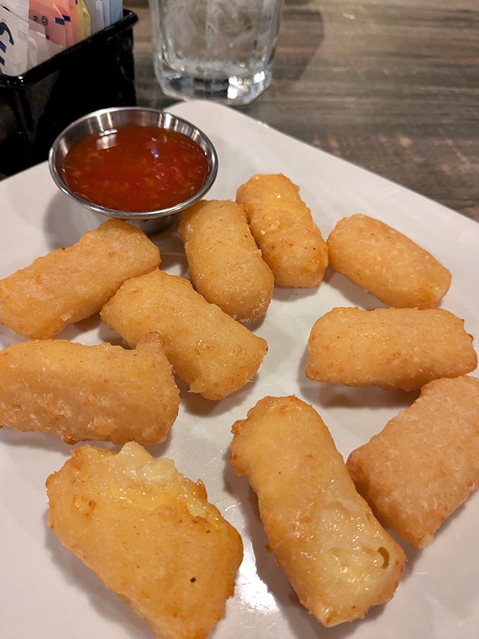 Golden-fried perfection with a side of tangy sauce—these aren't just appetizers, they're the opening act that threatens to steal the show.