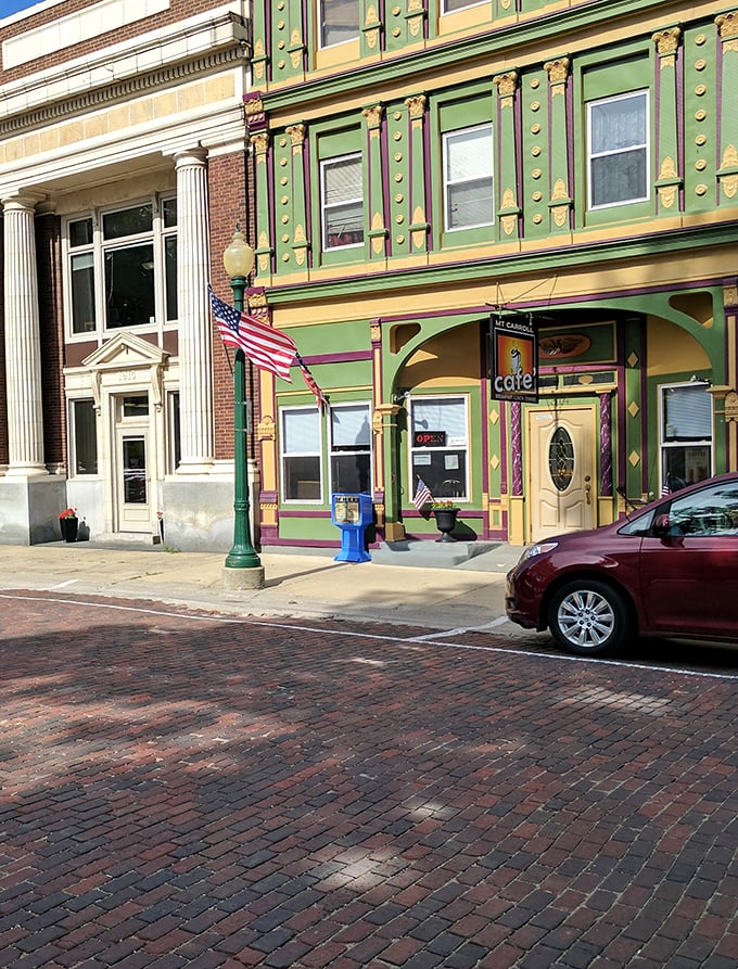 Mount Carroll Café's vibrant green and gold façade brings unexpected whimsy to the brick streetscape—like finding a peacock among pigeons.