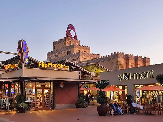 As evening falls, Flip Flop Shops and Ski-Mont illuminate beneath Citadel's castle-like towers, proving California really does have it all.