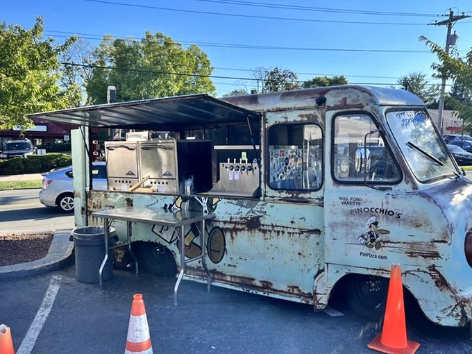The vintage food truck wears its age like badges of honor—each rust spot representing thousands of satisfied customers.