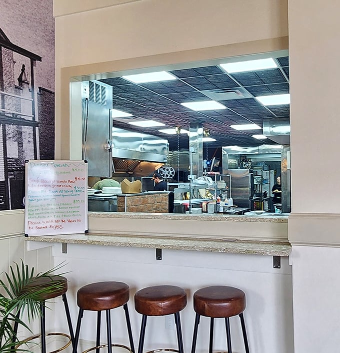 The open kitchen offers dinner and a show. There's something reassuring about watching skilled hands prepare what's about to become the highlight of your day.
