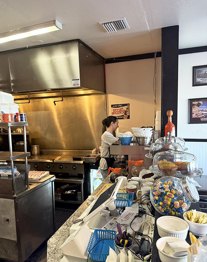 Behind the scenes magic where breakfast dreams come true—the open kitchen choreography is as satisfying as the food it produces.