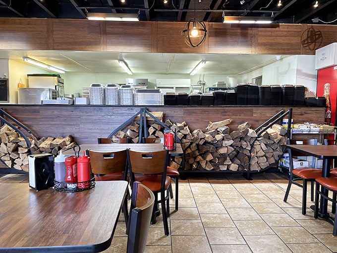 The stack of firewood isn't just for show—it's the secret ingredient that transforms ordinary meat into extraordinary barbecue through patience and smoke.
