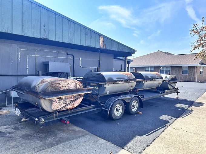 The outdoor smoker brigade—steel warriors that transform humble cuts into neighborhood legends through the ancient alchemy of smoke and patience.