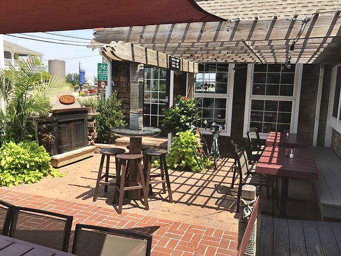 The outdoor patio—where summer breezes, cold drinks, and the promise of seafood create the perfect Delaware afternoon trifecta.